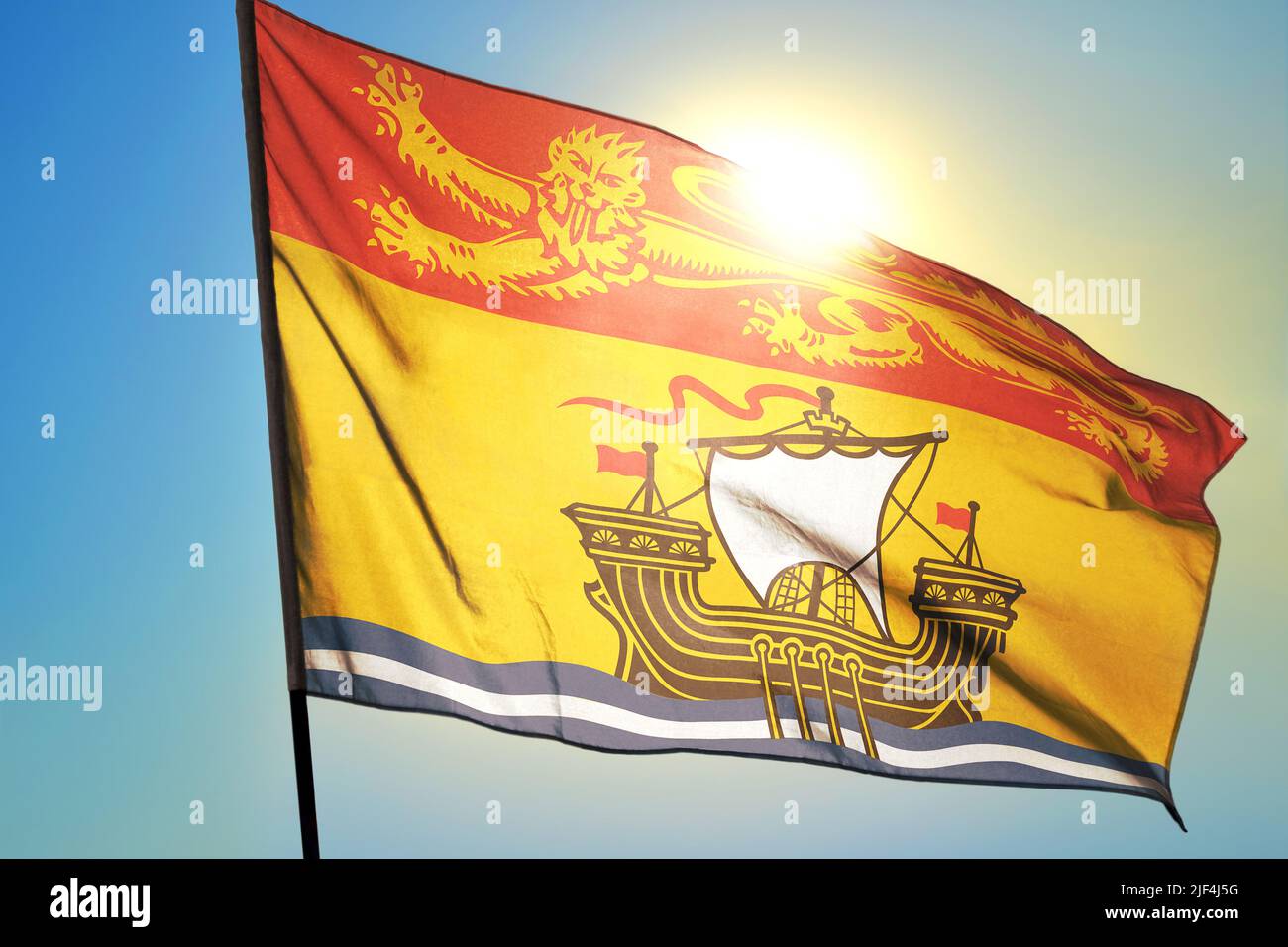 New Brunswick province of Canada flag waving on the wind Stock Photo ...