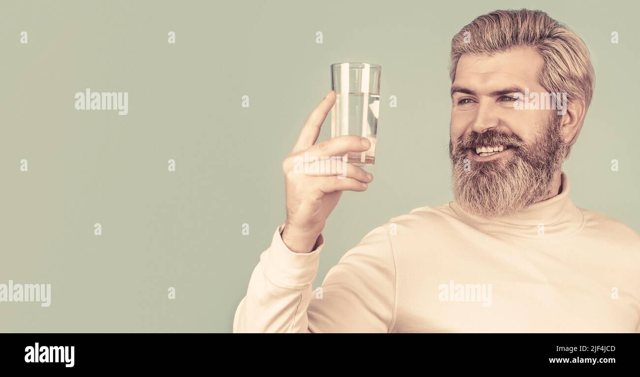 Male drinking from a glass of water. Health care concept, lifestyle ...