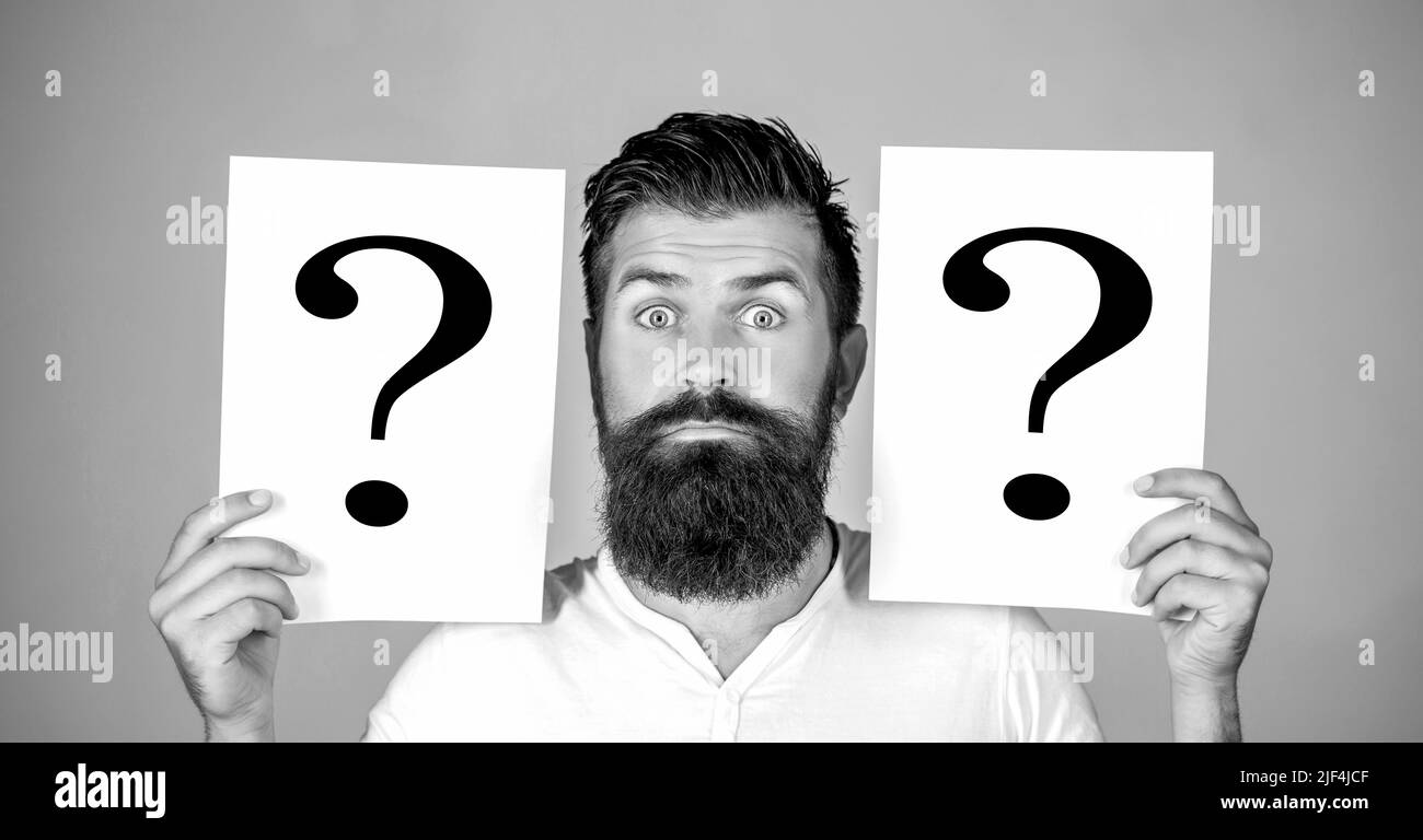 Man with question mark. Paper notes with question marks. Beard man ...