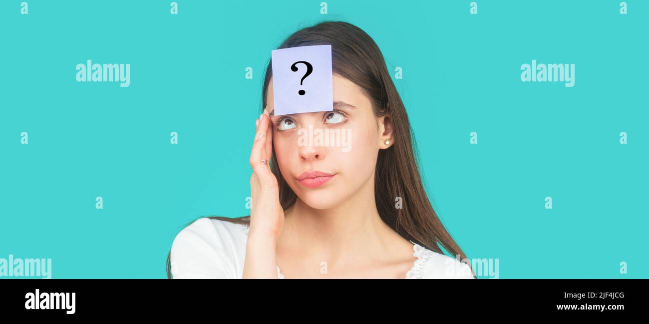 Paper notes with question marks. Doubtful girl asking questions to ...