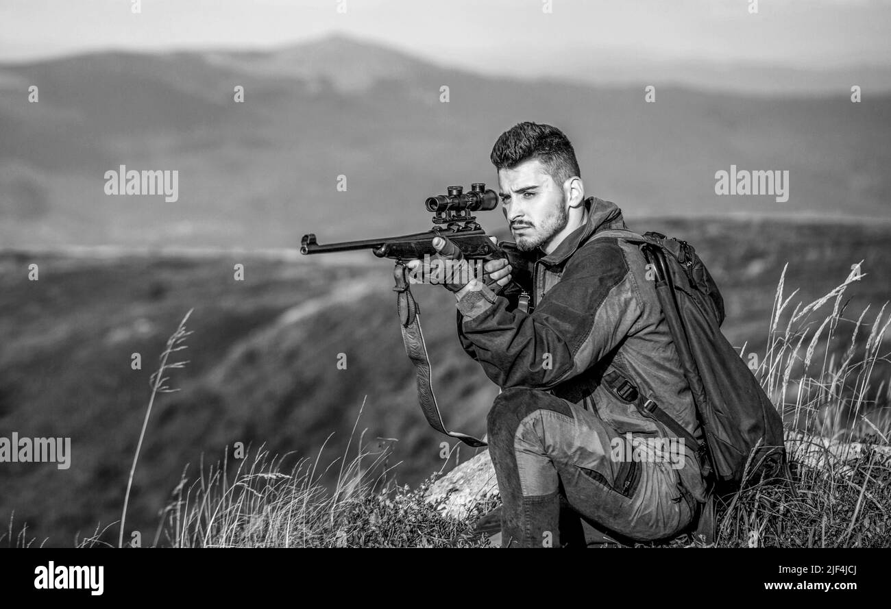 Shooter sighting in the target. The man is on the hunt. Hunt hunting ...