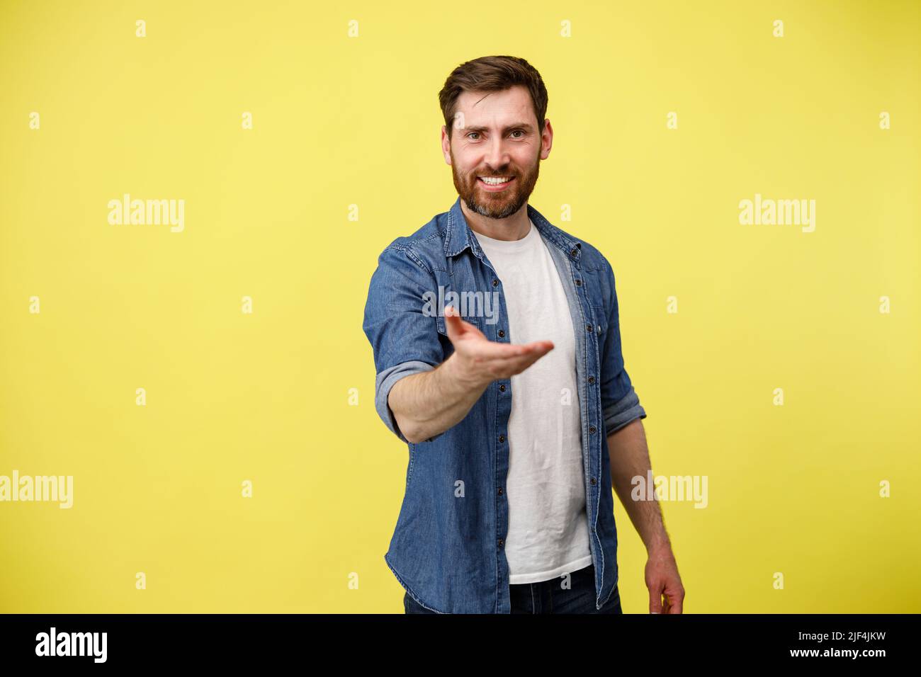 Inviting gesture young man hi-res stock photography and images - Alamy