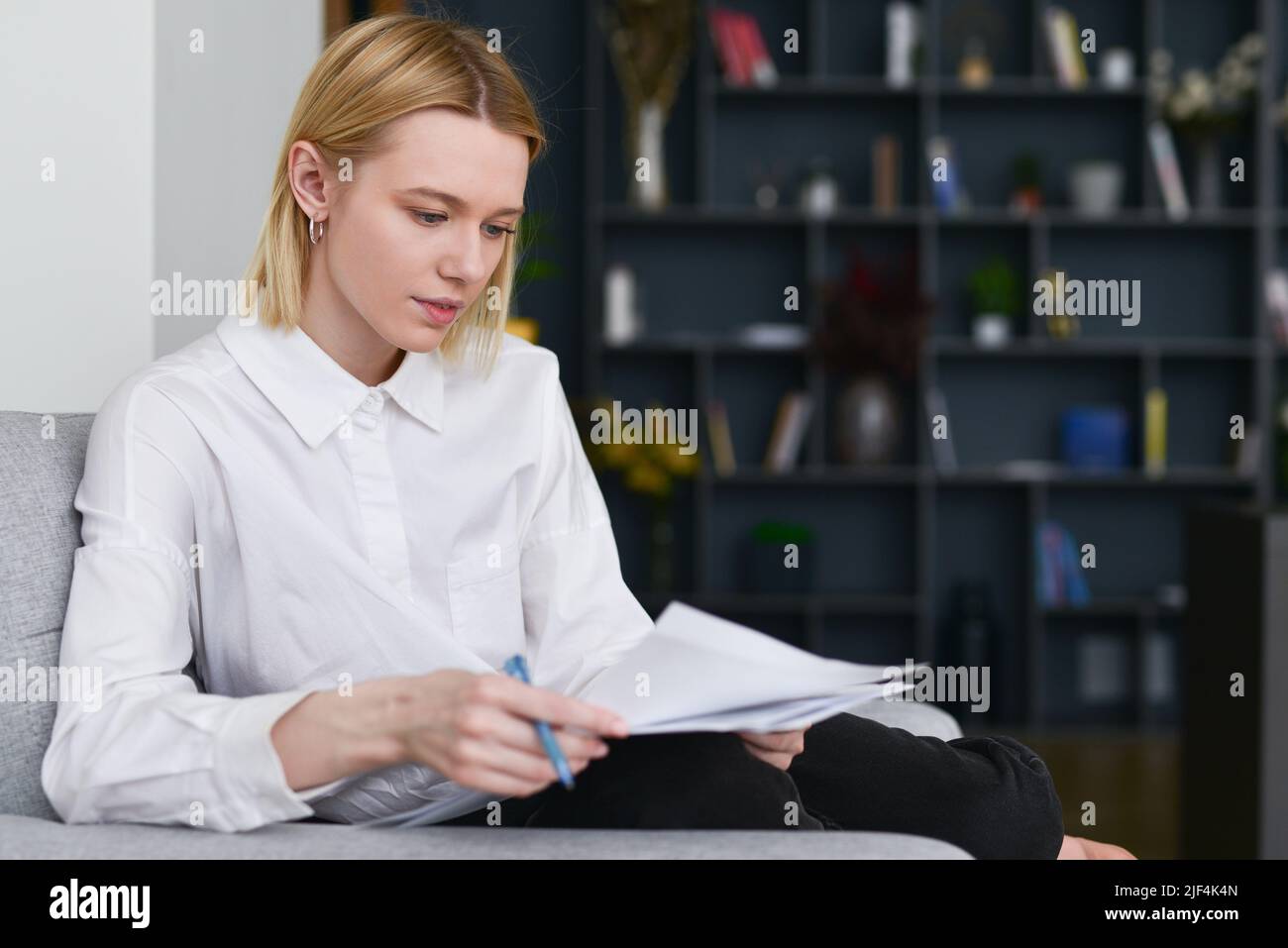 Businessperson in office reading documents hi-res stock photography and ...