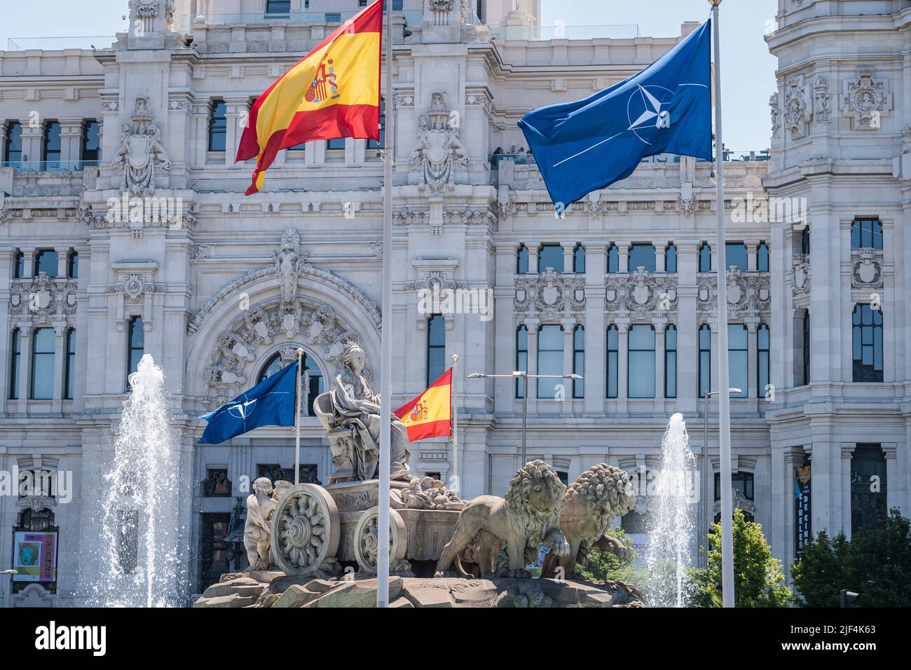 Cibeles fountain is pictured with flags of NATO and Spain during the ...