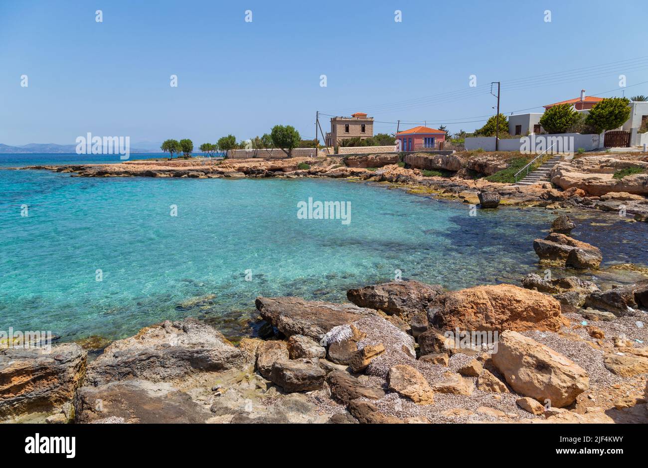 The coast of Aegina island with clear and blue waters of Mediterranean ...