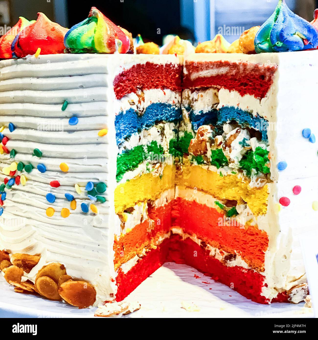 Layered cake celebrating LGBT pride with the rainbow colors and cream ...