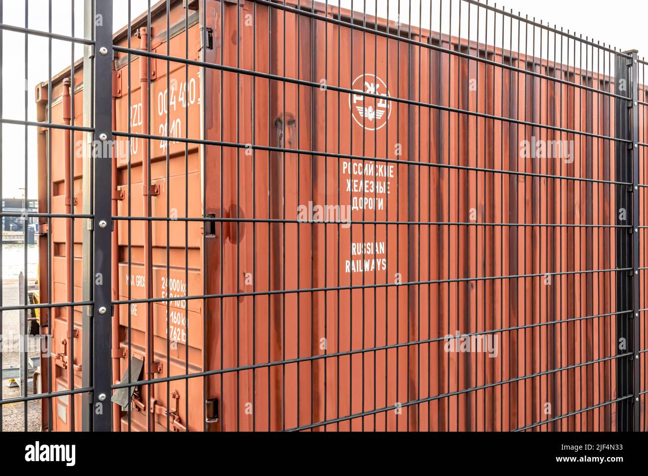 A Russian Railways shipping container behind a fence at a port of ...