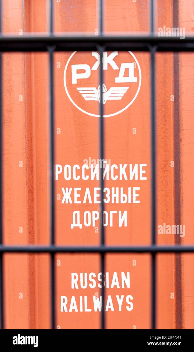 A Russian Railways shipping container behind a fence at a port of ...