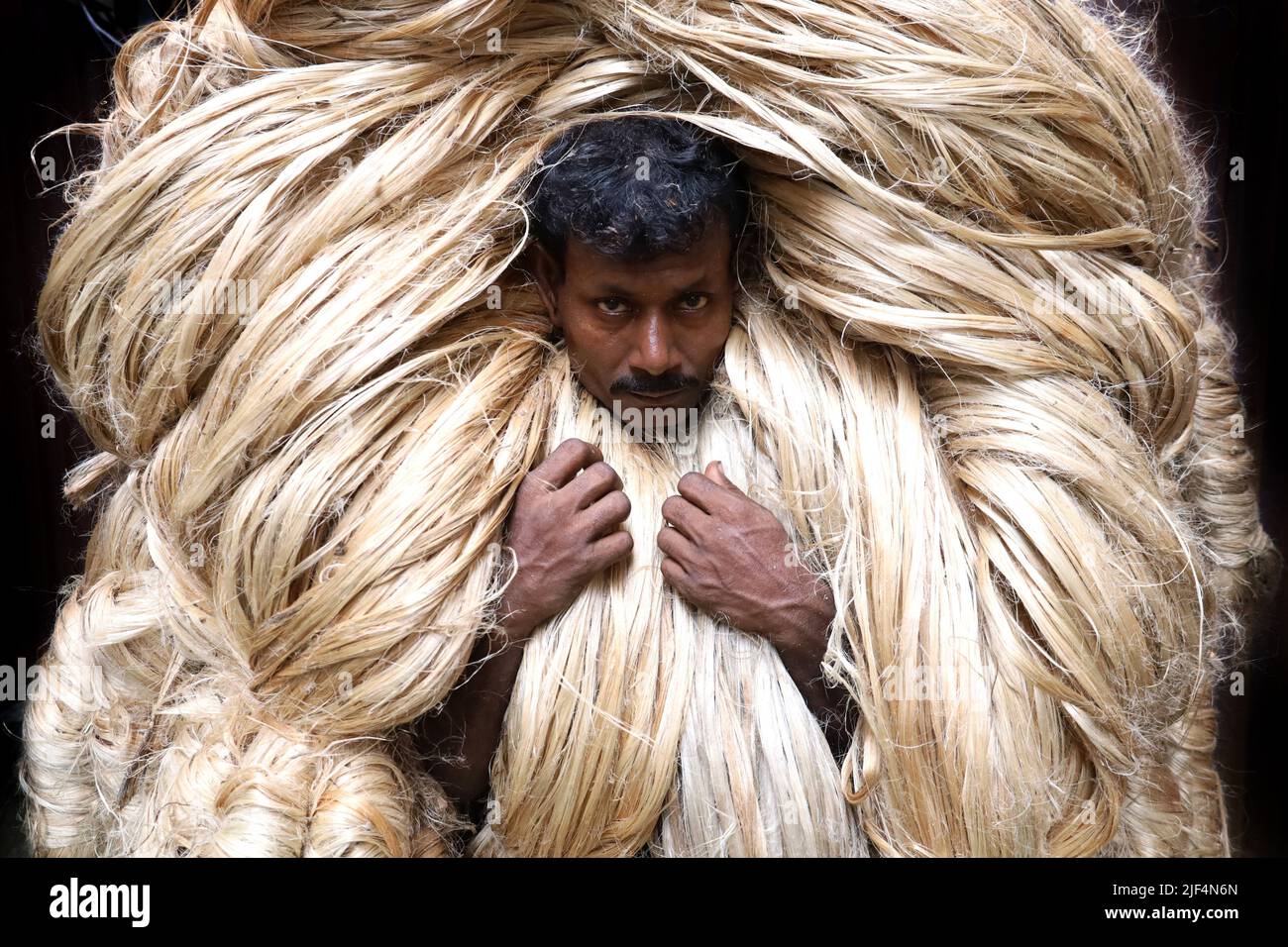 June 29, 2022, manikgonj, Manikgonj, Bangladesh: A man is carrying a ...