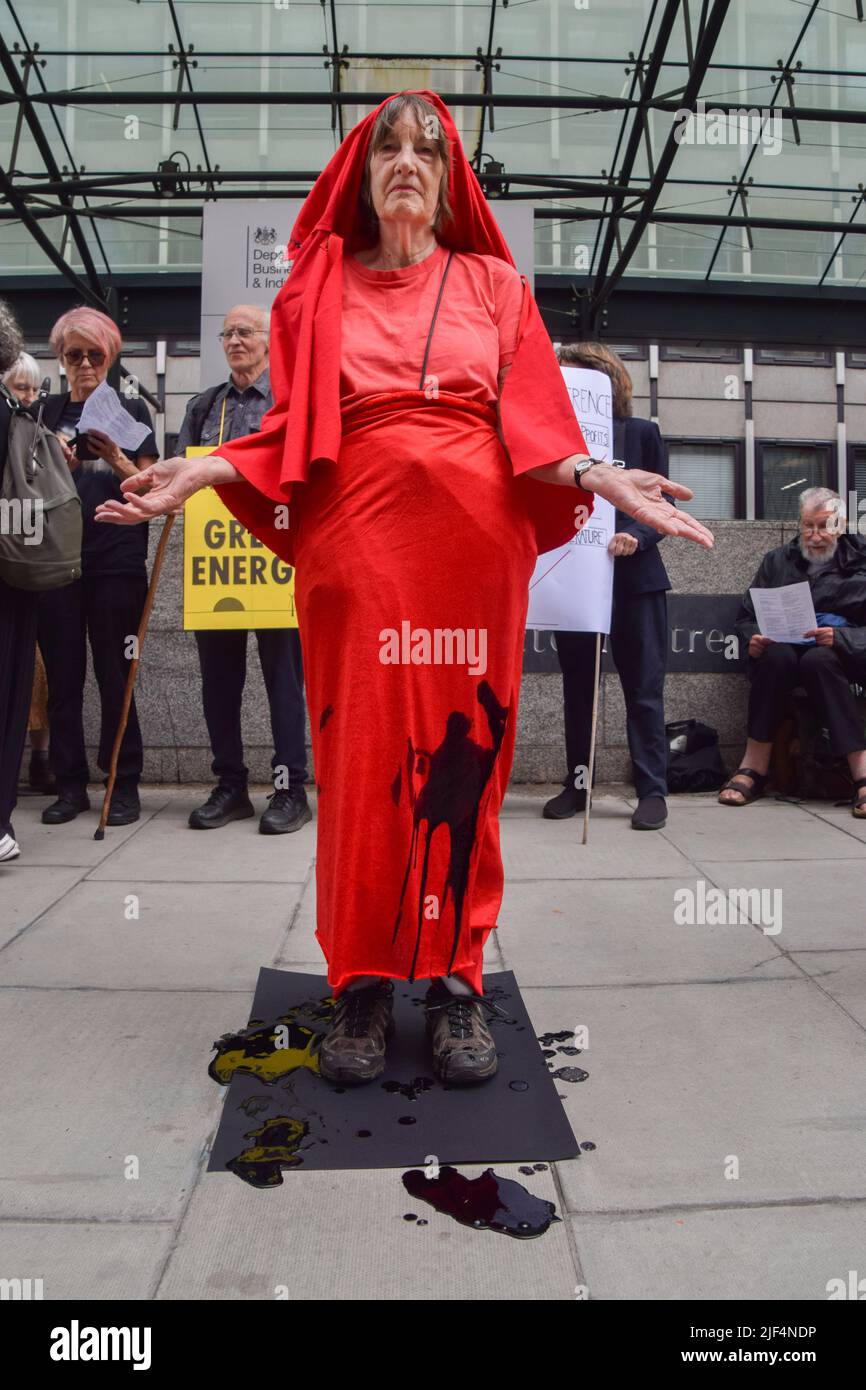 London, England, UK. 29th June, 2022. An activist wears a ''Red Alert ...