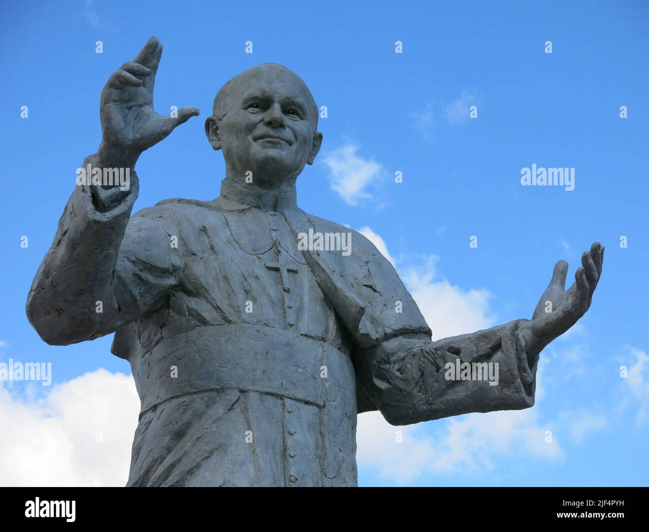 Close-up of the statue of Pope Jean-Paul II with open arms in a symbol ...