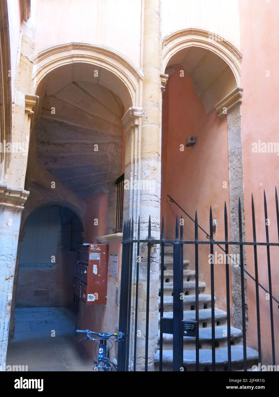 Vieux Lyon: a spiral staircase leads from the hidden courtyard along ...