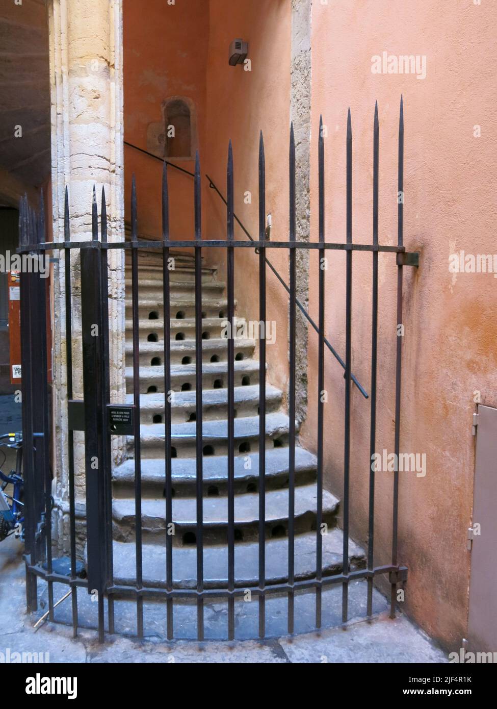 Vieux Lyon: a spiral staircase leads from the hidden courtyard along ...