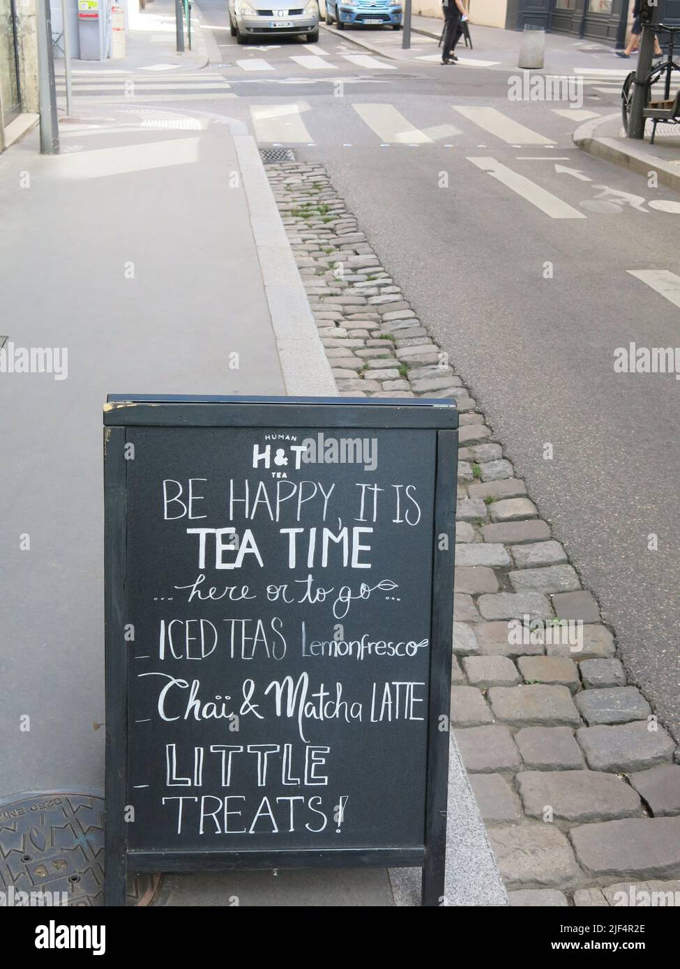 A sign outside a cafe in Lyon: "Be Happy it is Tea Time: iced teas ...