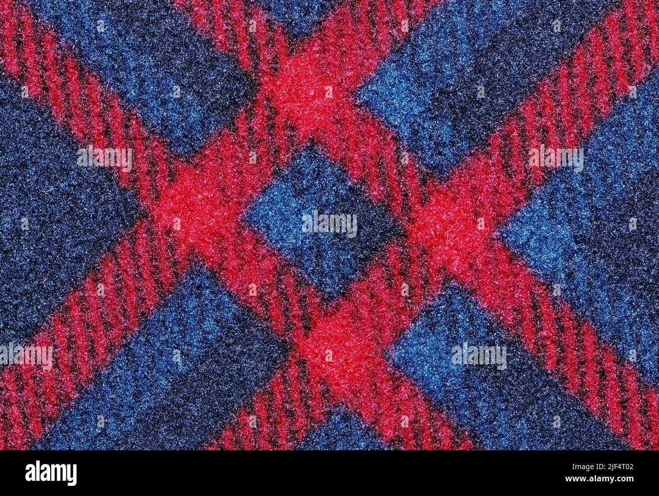 Red and blue plaid tartan design fabric pattern sample. Closeup color ...
