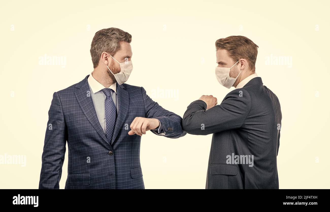 businessmen not shaking hands. social distancing during coronavirus ...