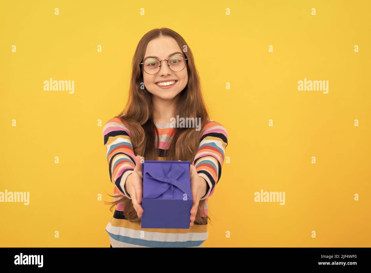 Child giving present hi-res stock photography and images - Alamy