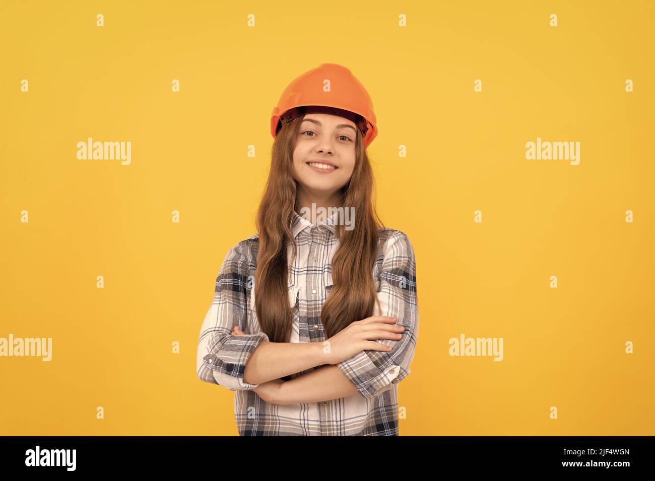 crossed hands. happy child worker wear hardhat. childhood development ...