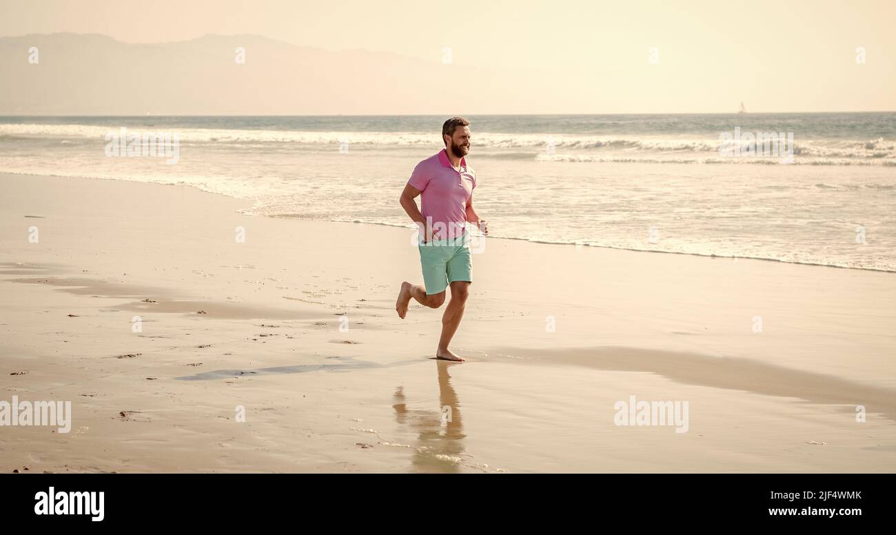 barefoot sprinter. sport athlete run fast to win in sea daytime ...