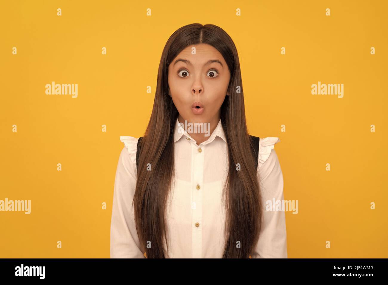 surprised teen girl with long hair. back to school. knowledge day ...