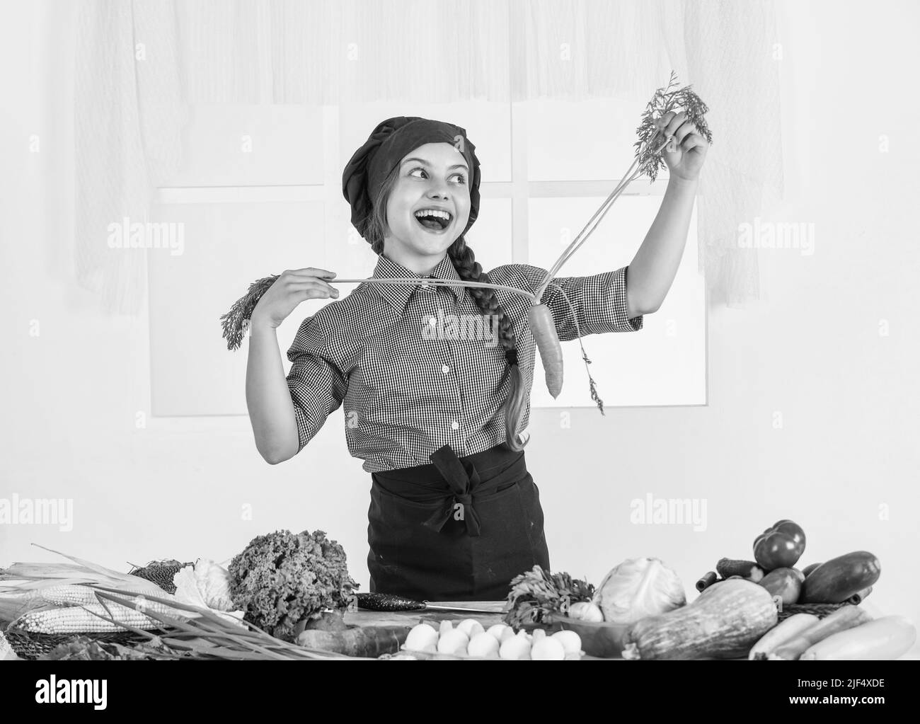 too much fun. girl with carrot full of vitamins. dieting and health ...