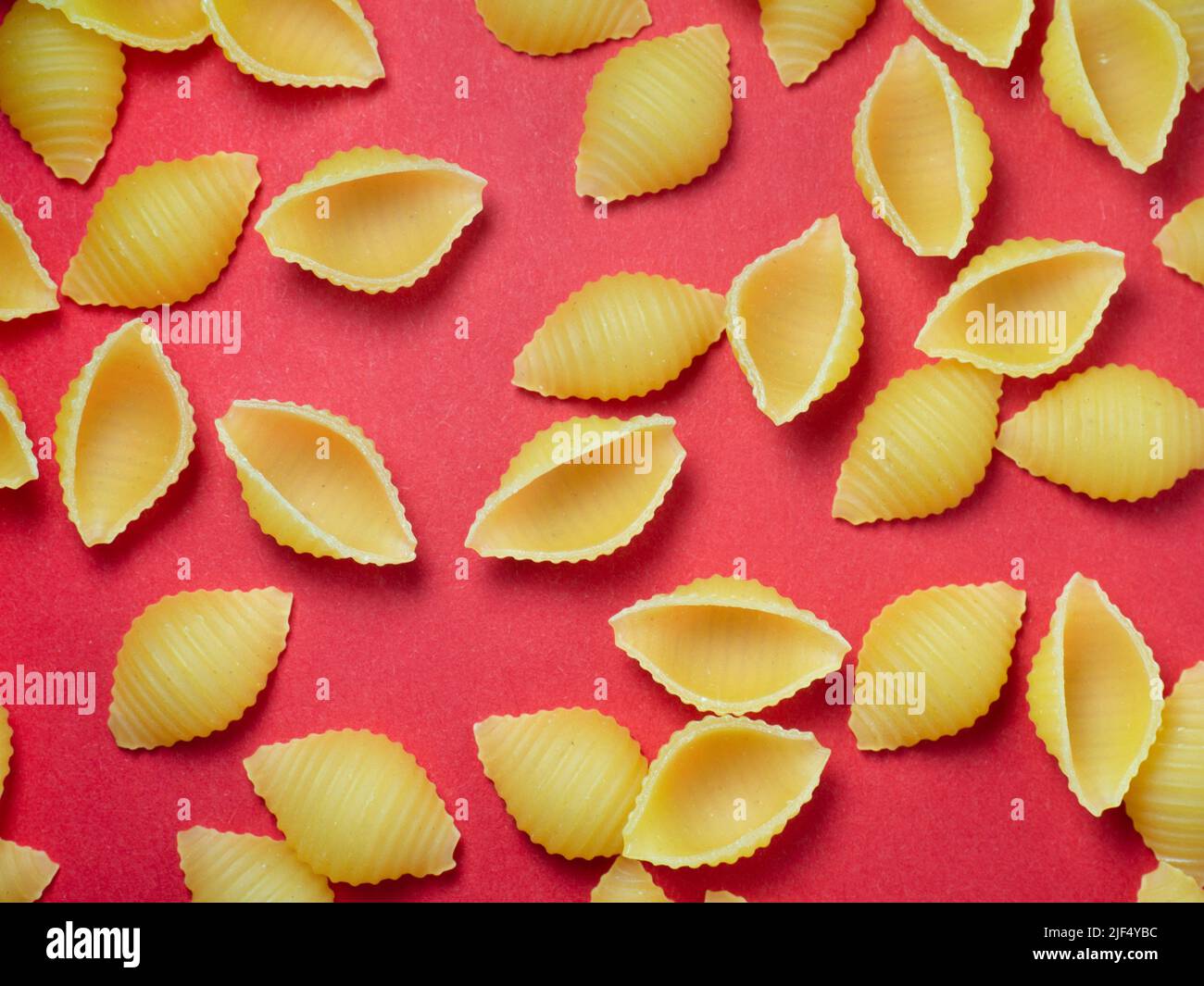 Shell-shaped pasta on the table. Background. Italian food. Cuisine of ...