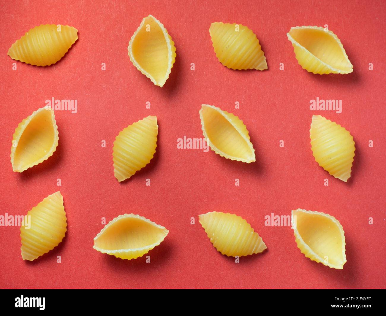 Shell-shaped pasta on the table. Background. Italian food. Cuisine of ...