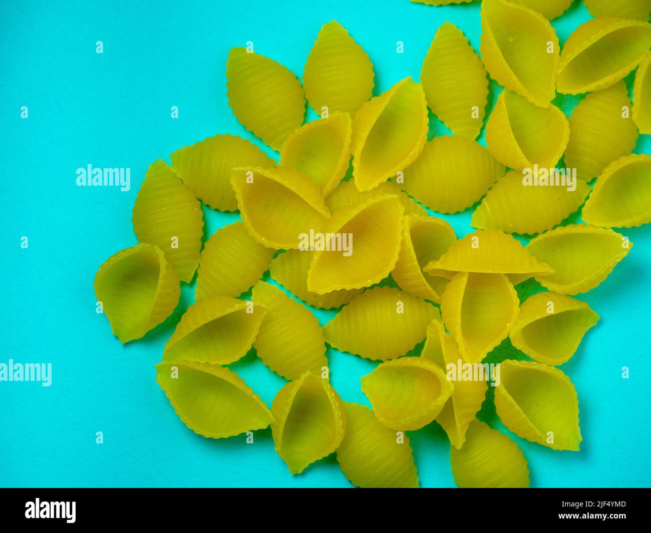 Shell-shaped pasta on the table. Background. Italian food. Cuisine of ...