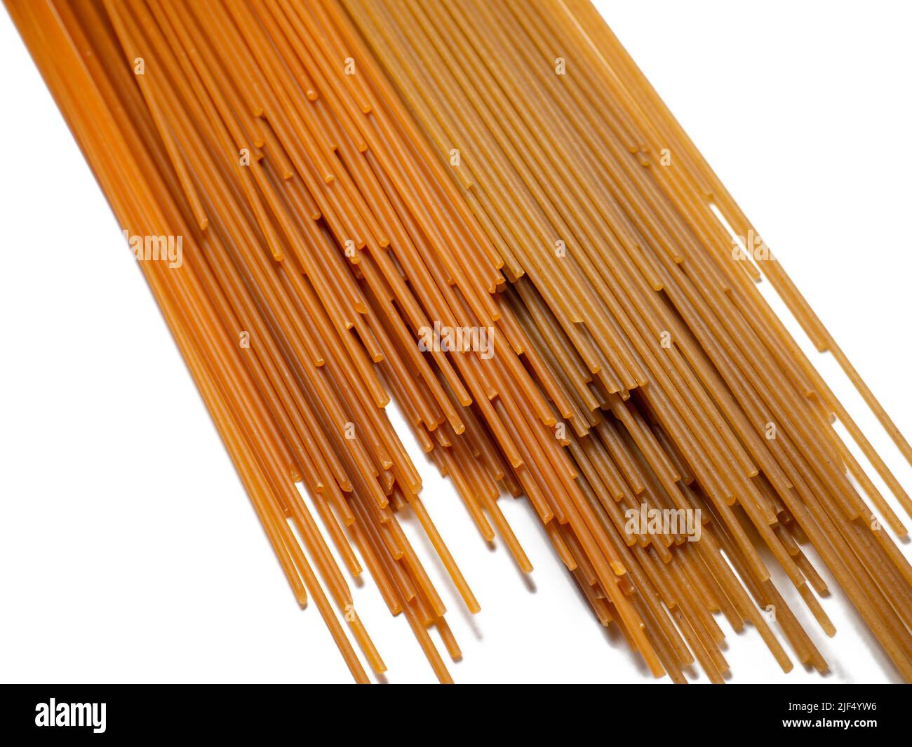Pasta on the table. Spaghetti of two types on a white background ...