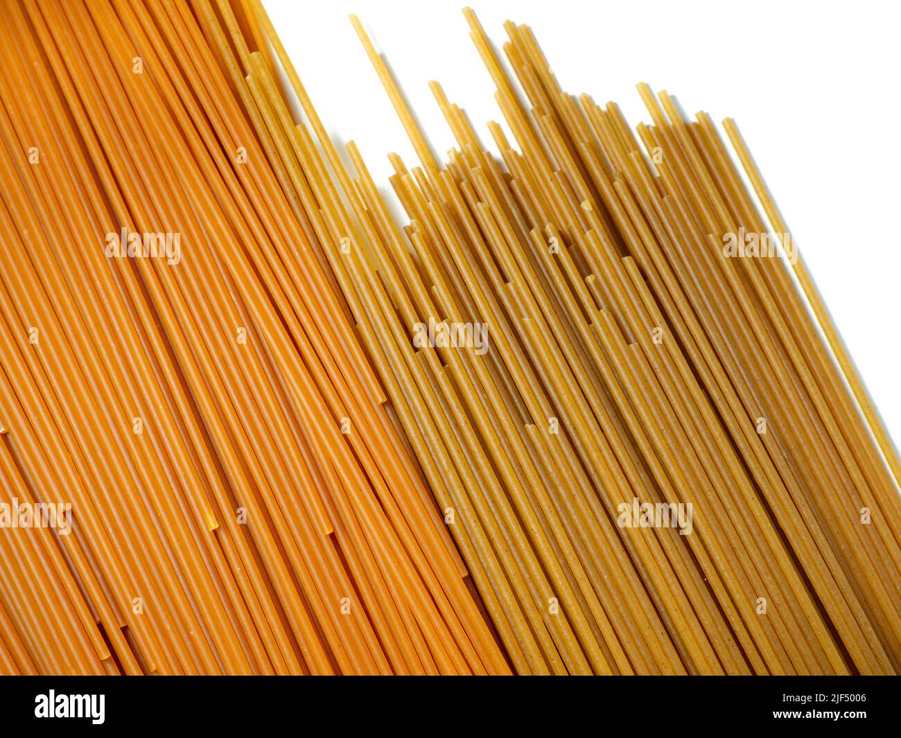 Pasta on the table. Spaghetti of two types on a white background ...