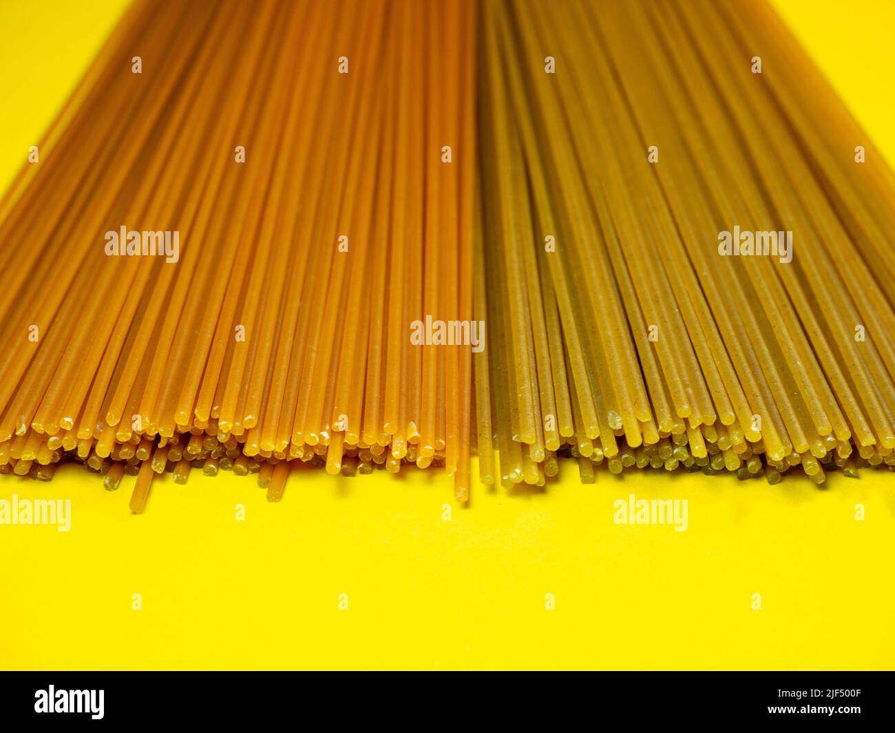 Pasta of two types on the table. Tomato and buckwheat spaghetti ...