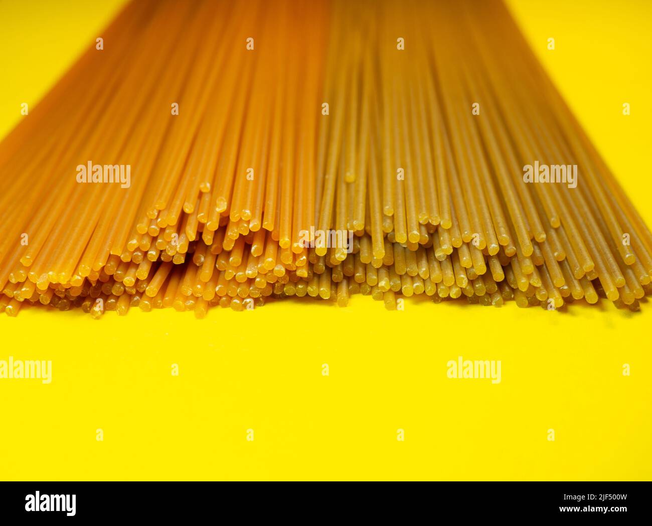 Pasta of two types on the table. Tomato and buckwheat spaghetti ...