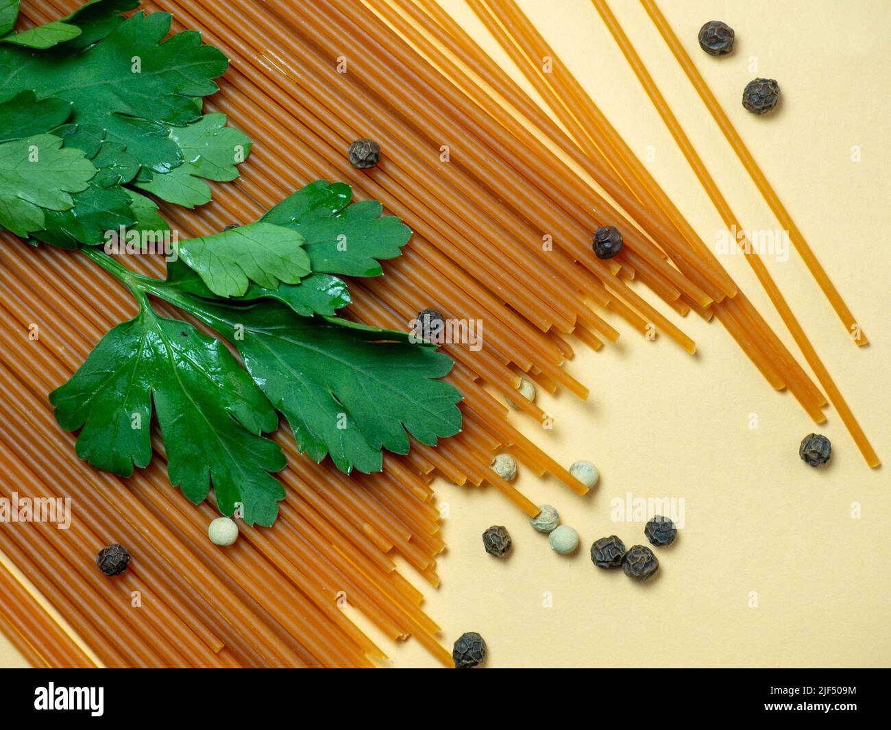 Spaghetti of two types on the table. Tomato pasta. Italian food. Long ...