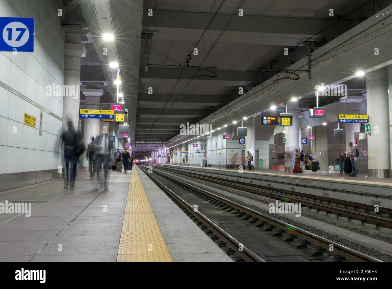 Motion in the busy train station platform Stock Photo - Alamy