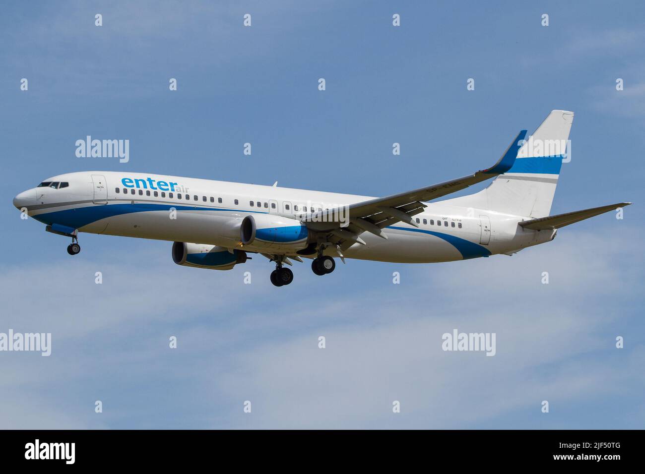 An Enter Air aircraft from Poland landing in Graz in front of blue sky ...