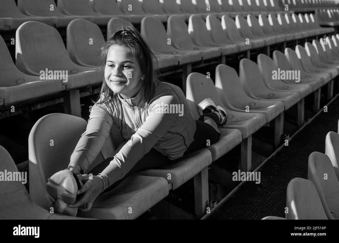 Athletic fit flexible girl child do splits leg stretch gymnastic ...