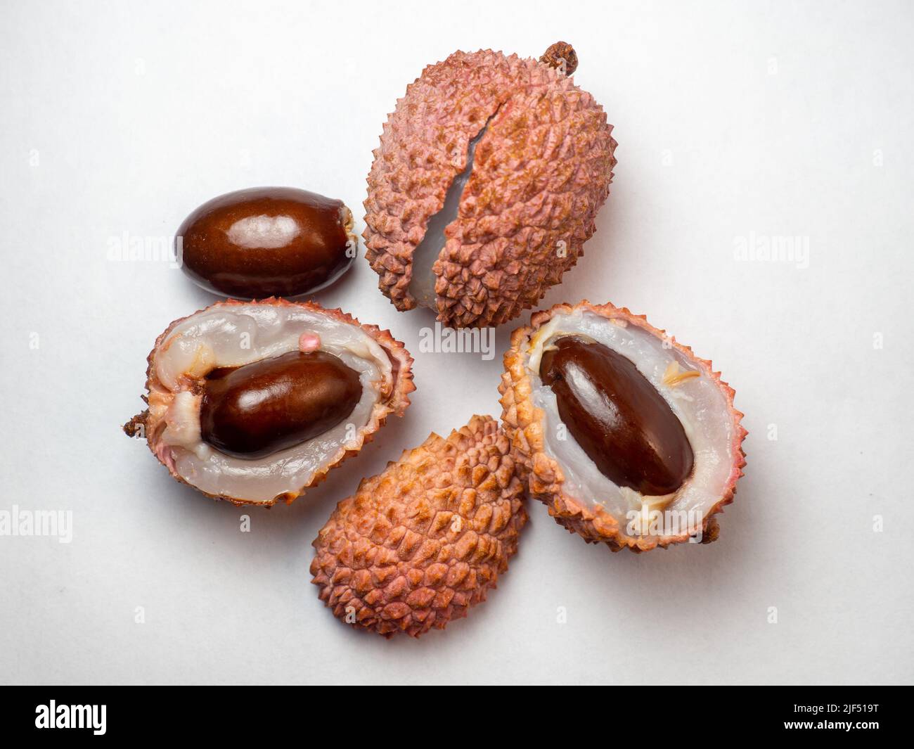 Sliced lychee. Round pimply fruits. Chinese plum. Fruit peel. Peeling ...