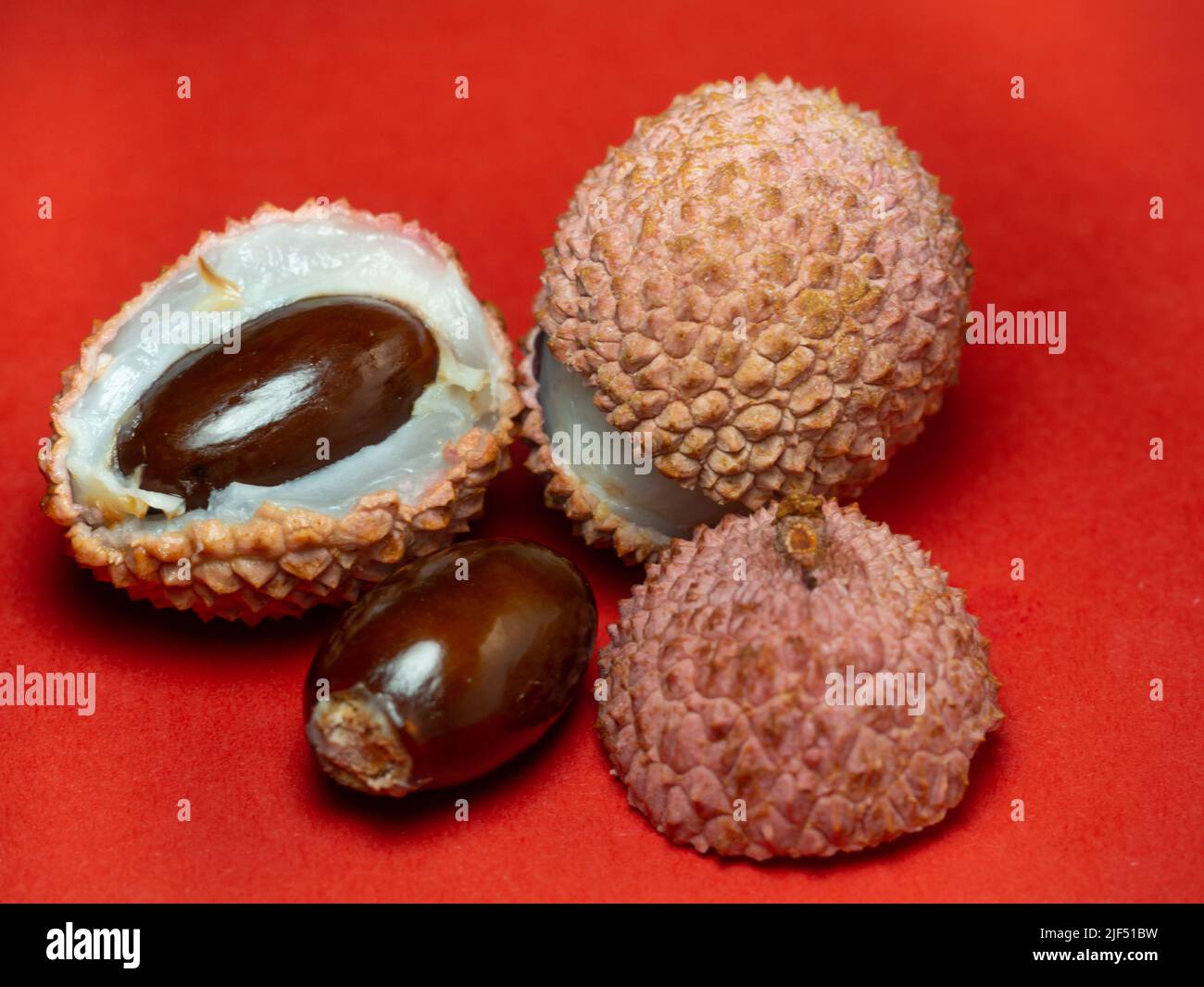 Sliced lychee. Round pimply fruits. Chinese plum. Fruit peel. Peeling ...