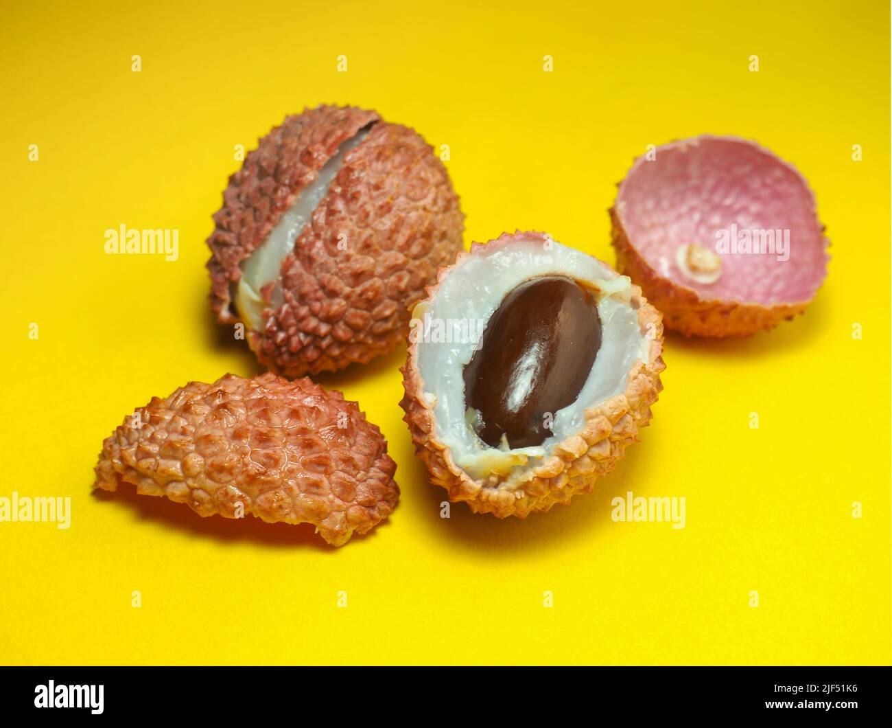 Sliced lychee. Round pimply fruits. Chinese plum. Fruit peel. Peeling ...