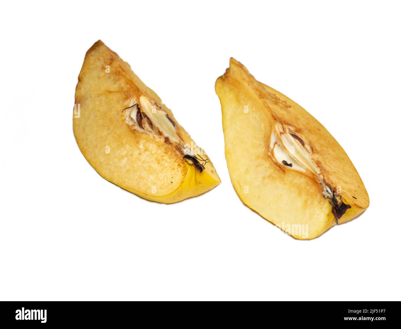 chopped quince. Juicy fruits on a white background. Ripe useful product ...