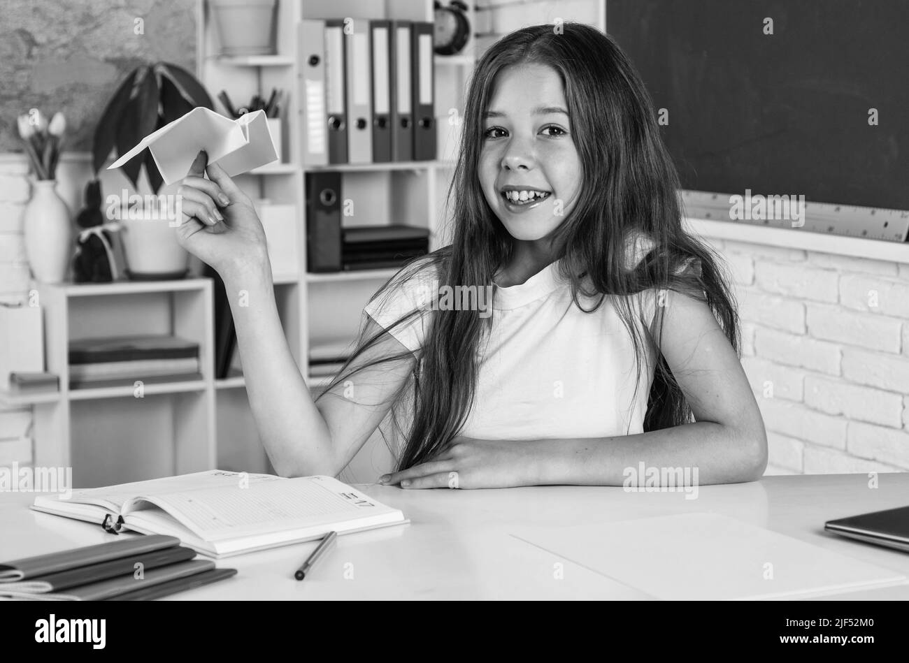 happy child in classroom school with blackboard, education Stock Photo ...