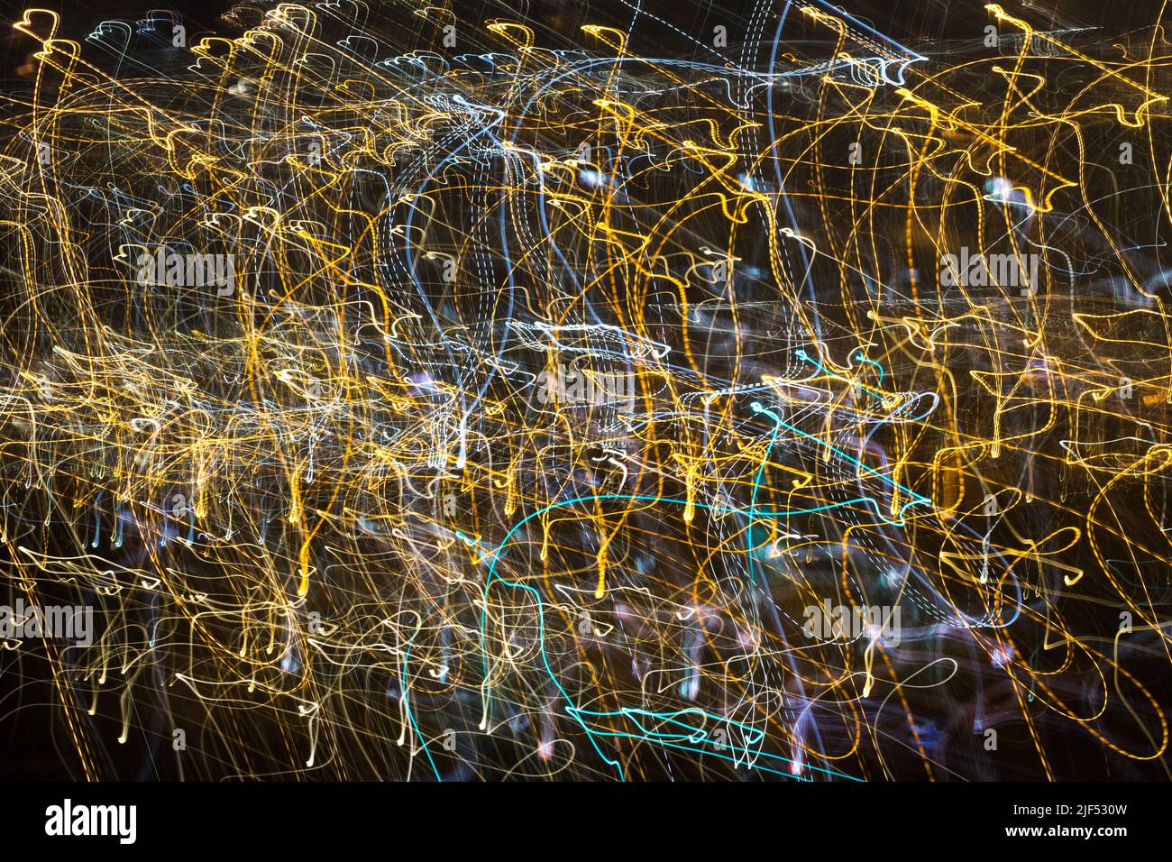 Abstract image of colorful dancing lights on a dark background. Lines ...