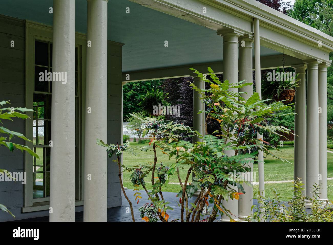 The garden porch around the back of the historic Lyman Estate home ...