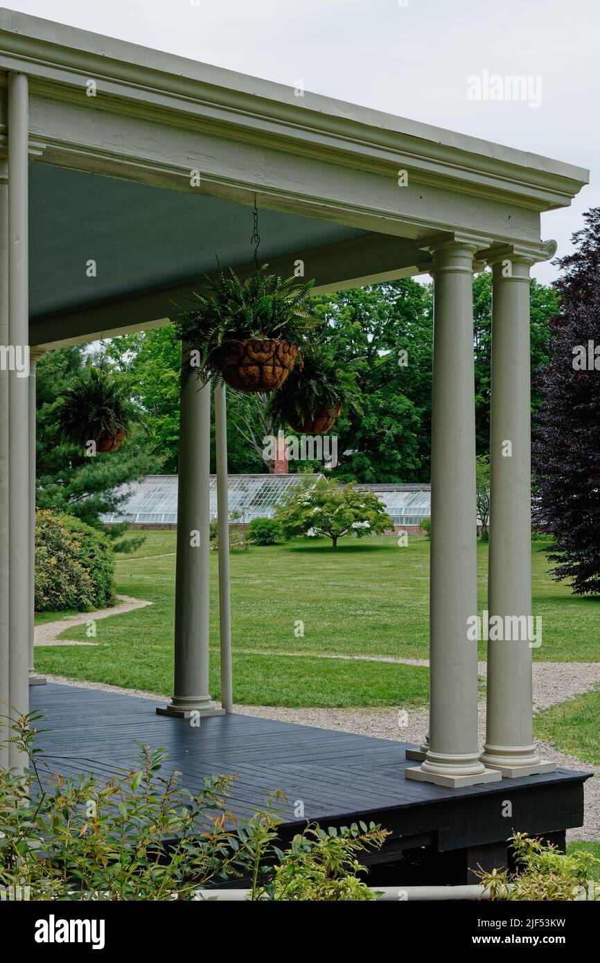 The garden porch around the back of the historic Lyman Estate home ...