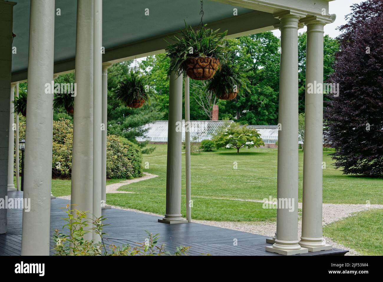 The garden porch around the back of the historic Lyman Estate home ...
