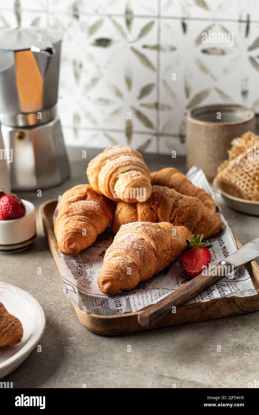 Delicious breakfast with croissants, coffee, honey composition with ...