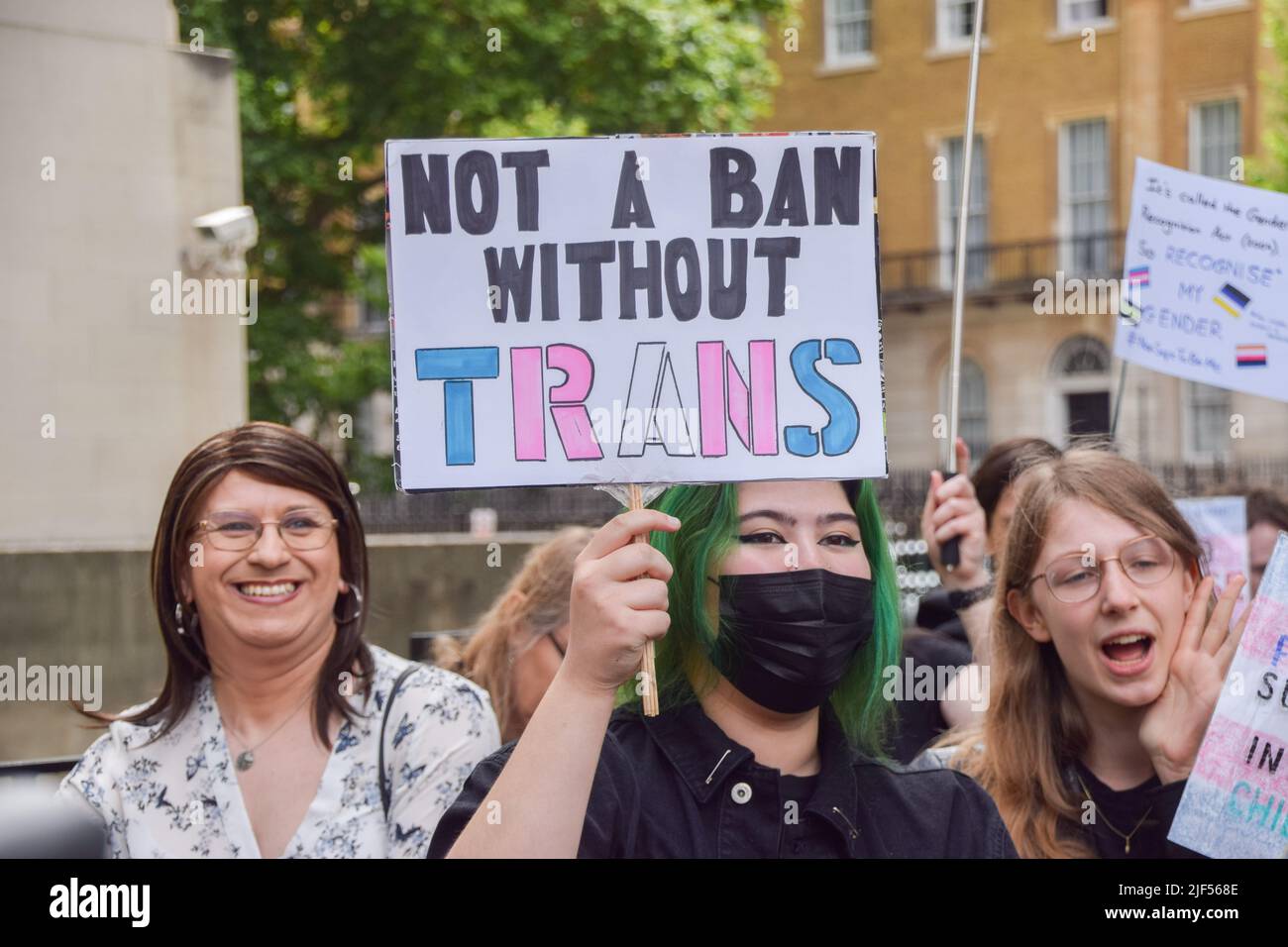London, UK. 29th June, 2022. A protester holds a placard in support of ...