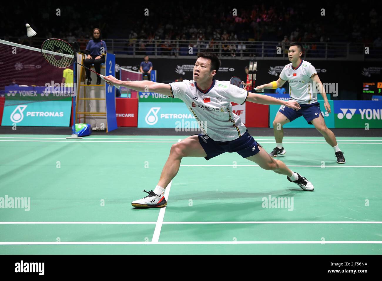 Ren Xiang Yu (L) and Tan Qiang of China play against Mohammad Ahsan and ...