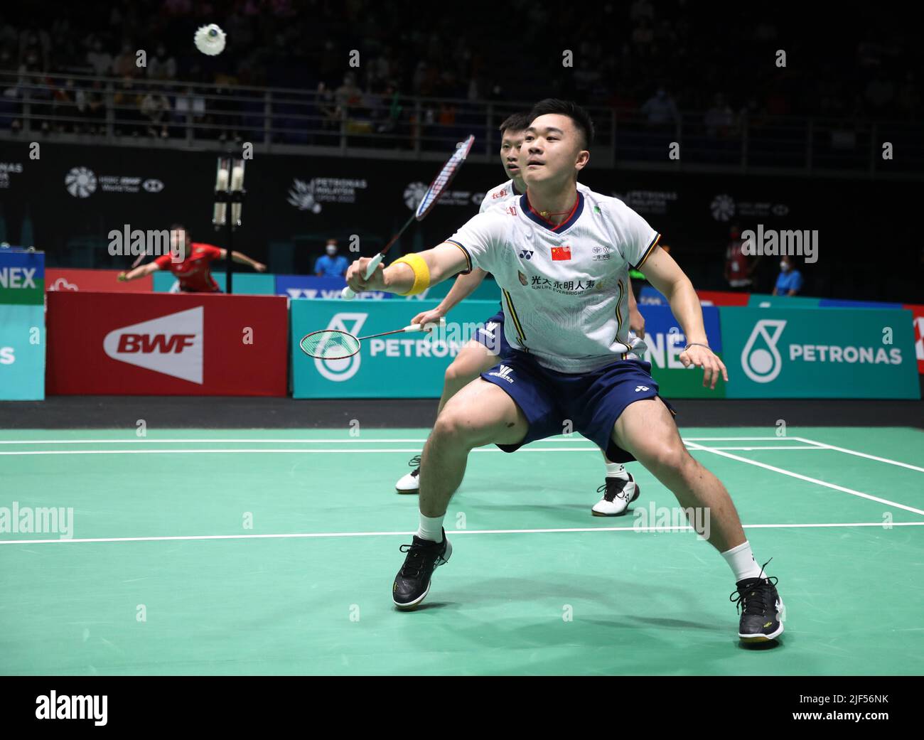 Ren Xiang Yu and Tan Qiang (Front) of China play against Mohammad Ahsan ...