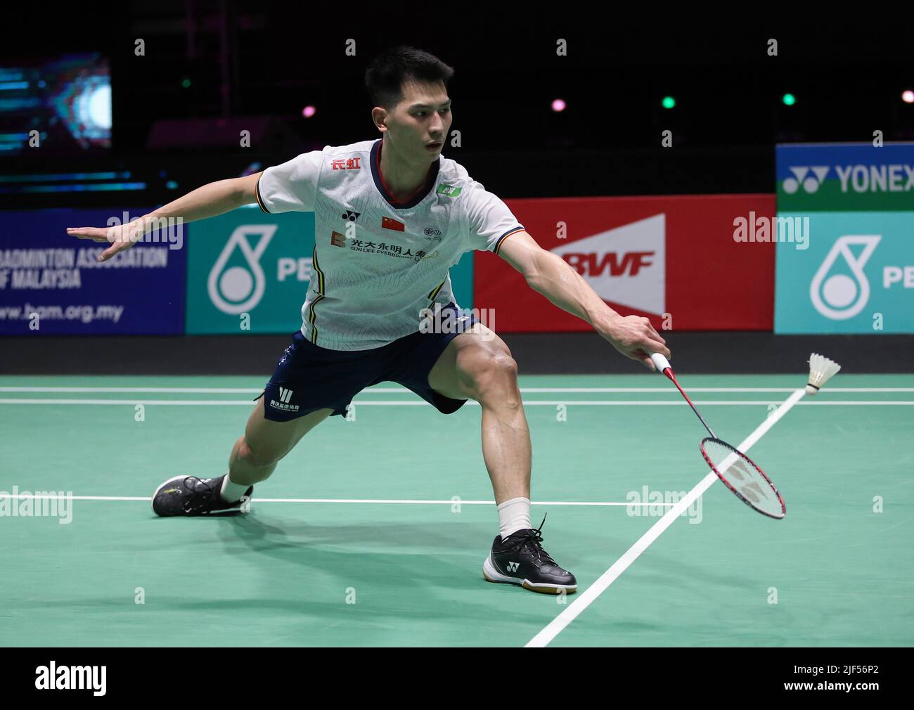 Zhao Jun Peng of China competes against Kunlavut Vitidsarn of Thailand ...